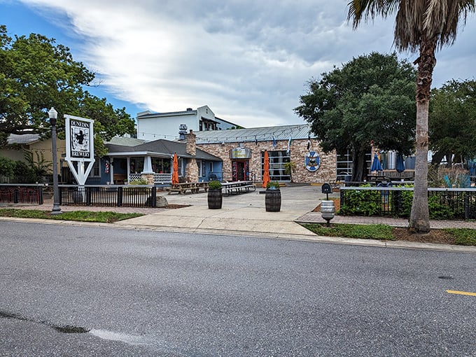 Dunedin Brewery's stone facade welcomes visitors with a promise of craft beer excellence and Florida charm, standing proudly on Main Street.