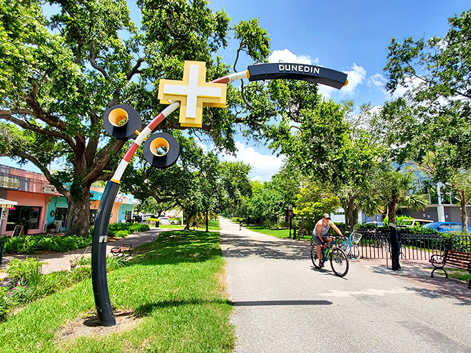 The iconic Dunedin trail marker welcomes cyclists and pedestrians with its whimsical design &ndash; small-town charm engineered into functional art.