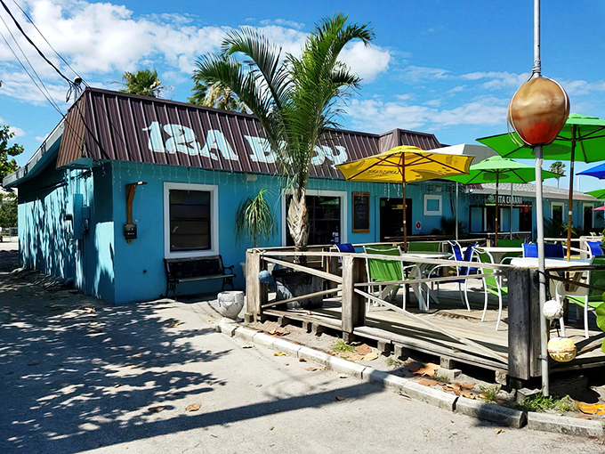 The vibrant turquoise exterior of 12A Buoy beckons seafood lovers with its casual charm and promise of oceanic delights.