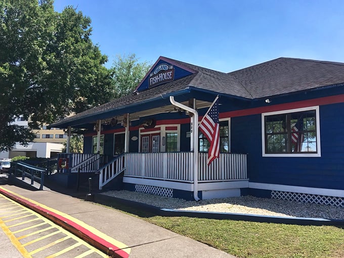 The DeLand Fish House welcomes hungry visitors with its charming navy blue exterior and inviting front porch &ndash; a seafood sanctuary hiding in plain sight.
