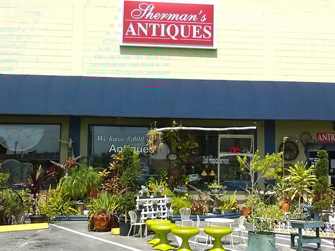Sherman's Antiques welcomes treasure hunters with its classic storefront and vibrant outdoor display – a hint of the wonders waiting inside.