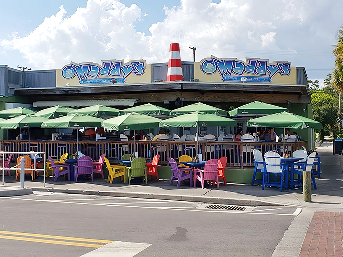 Exterior: Rainbow-colored Adirondack chairs welcome visitors to O'Maddy's, where the vibrant exterior promises the Florida experience you've been craving.