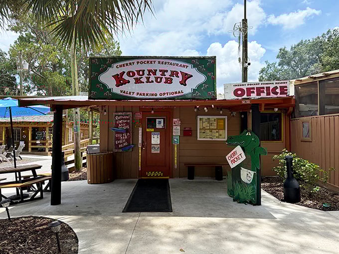 Welcome to old Florida charm! The unassuming entrance to Cherry Pocket promises authentic seafood treasures behind that weathered sign and friendly alligator mascot.
