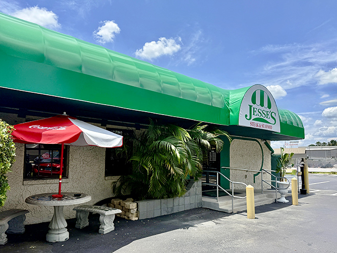 The iconic green awning of Jesse's Steak & Seafood stands as a beacon for meat lovers, promising legendary char-grilled goodness within.