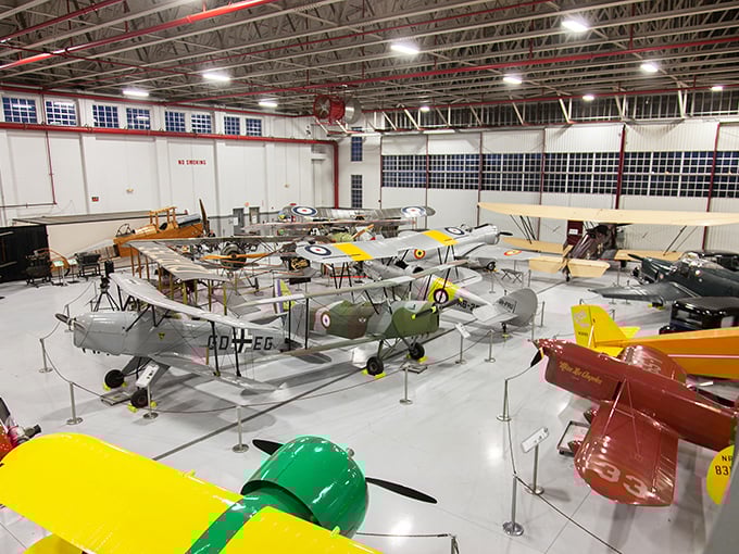 Fantasy of Flight's main hangar &ndash; a cathedral of aviation where dozens of meticulously restored vintage aircraft gleam under bright lights, each with stories to tell.