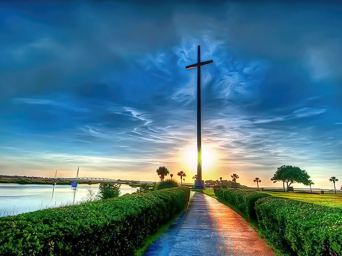 The Great Cross pierces the Florida sky like a celestial bookmark, catching sunset colors that would make even the most jaded traveler pause in wonder.