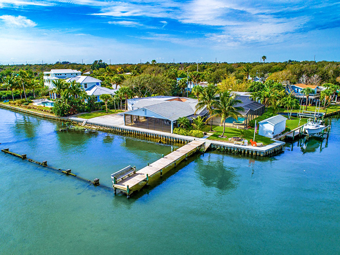 Waterfront homes with private docks create a postcard-perfect scene where Florida living meets maritime charm.