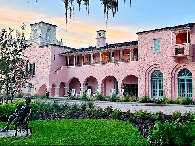 Hacienda Hotel: The pink palace stands majestically against the Florida sky, its Mediterranean Revival architecture whispering tales of Gatsby-era glamour and sun-soaked secrets.