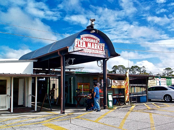 The iconic barn-shaped entrance to Oldsmar Flea Market welcomes treasure hunters with the promise of discoveries waiting just beyond those doors.