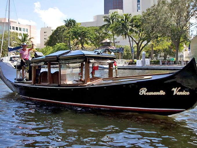 The elegant "Romantic Venice" gondola glides through Fort Lauderdale's waterways, bringing Italian charm to Florida's sunshine coast.