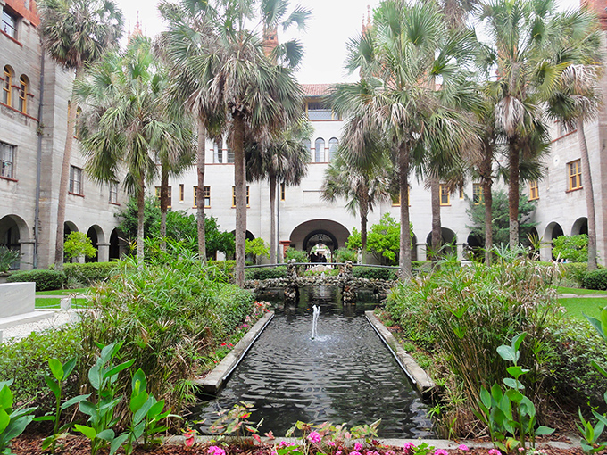 A serene oasis where history whispers through palm fronds &ndash; the Lightner Museum's courtyard invites visitors to step back in time while koi fish glide below.