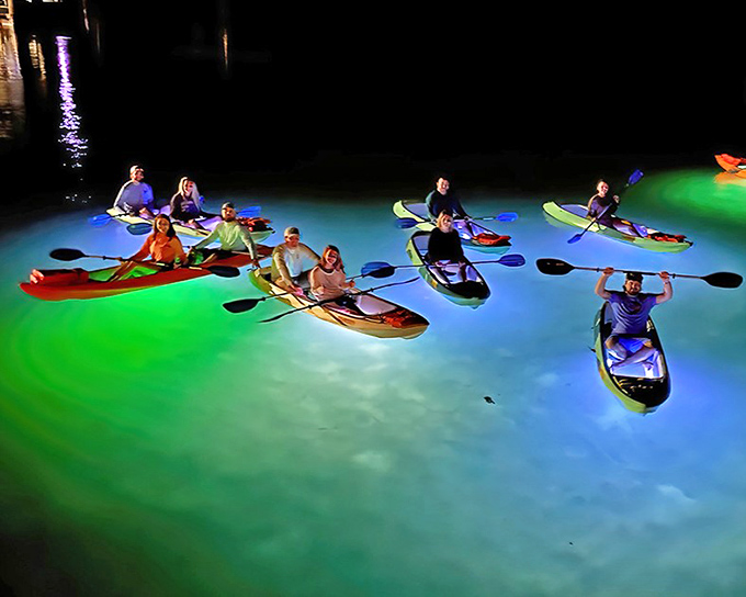 Night Kayak Key West: A constellation of colorful kayaks glows against the dark water, creating a surreal floating light show for adventurous souls.