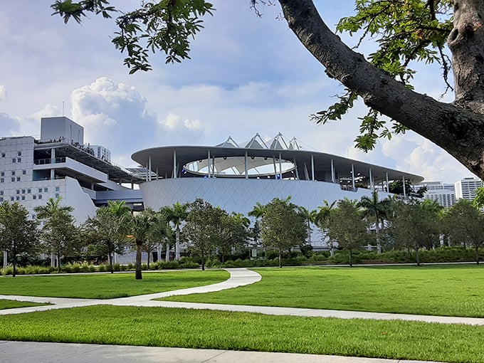 The Frost Museum's striking architecture rises like a futuristic beacon against Miami's blue skies, promising scientific wonders within.