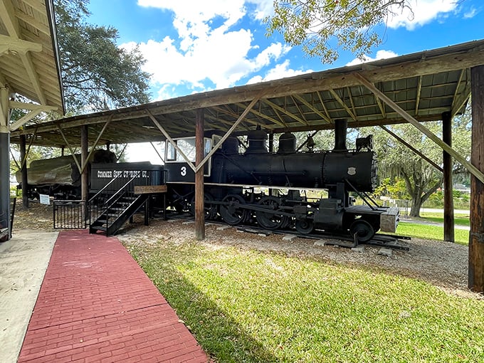 The magnificent Porter Steam Engine No. 3 rests under shelter, its black iron frame a testament to Florida's railroad heritage.