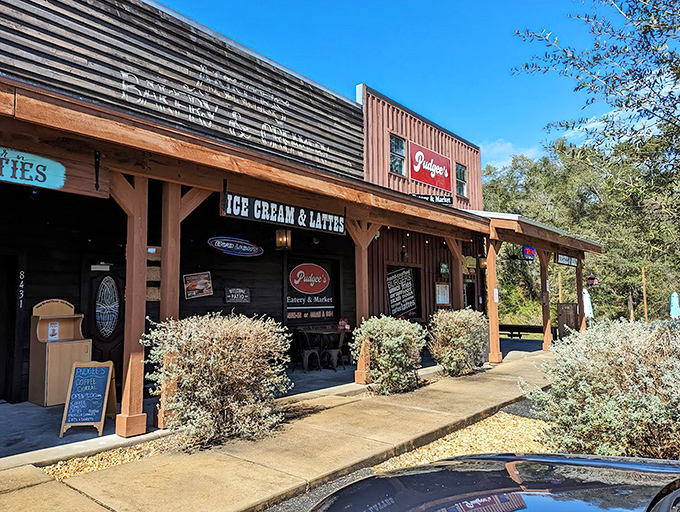 Pudgee's rustic wooden exterior beckons road-weary travelers with promises of comfort food that'll make your cardiologist wince and your taste buds sing.