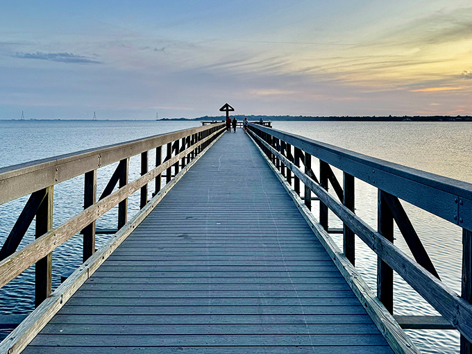 A wooden pier stretches into Tampa Bay, inviting visitors to stroll into serenity and perhaps catch dinner along the way.