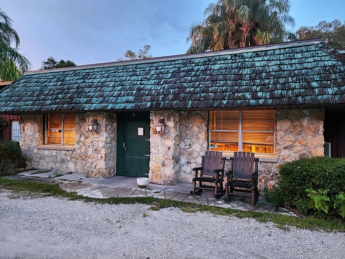 Red Wing Restaurant&rsquo;s rustic stone exterior glows at dusk, promising authentic flavors that have drawn devoted Groveland diners for generations.