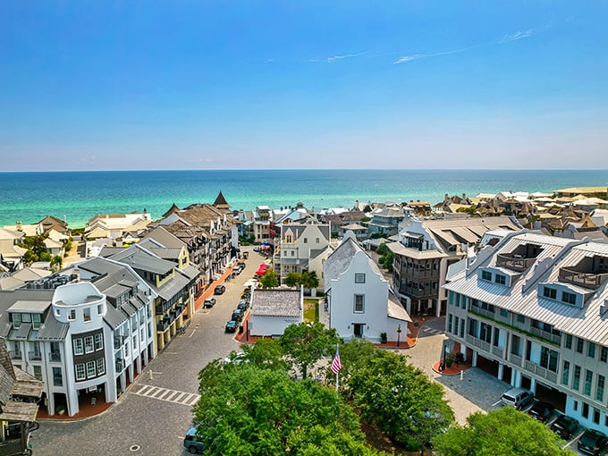 Aerial view of Rosemary Beach showcasing its pristine coastline and charming architecture &ndash; where turquoise waters meet picture-perfect streets.