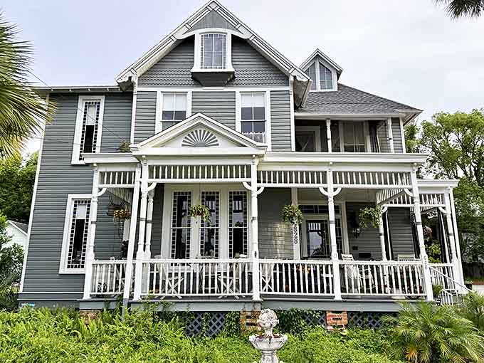 The stately Victorian facade of Seven Sisters Inn stands proudly in Ocala, its wraparound porch inviting visitors into a world where history lingers in every corner.