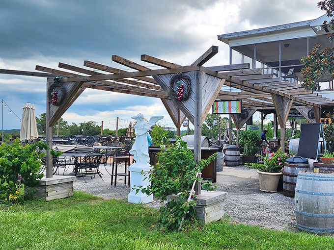 Rustic wooden pergolas frame the entrance to Sparacia Witherell, where vineyard views and Florida sunshine create an instant escape from everyday life.