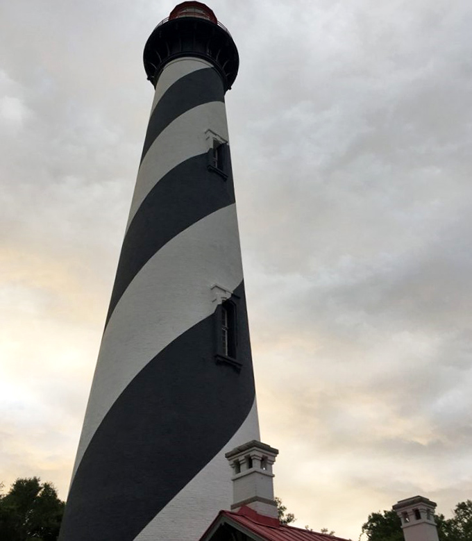 St. Augustine Lighthouse: The iconic black and white spiral stripes reach toward the heavens, a maritime candy cane against Florida's moody sky.