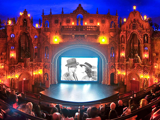 The Tampa Theatre's atmospheric interior transforms moviegoing into time travel, where Mediterranean fantasy meets cinematic magic under a twinkling night sky.