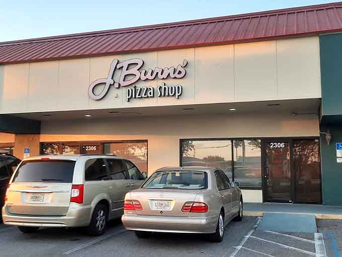 The unassuming exterior of J Burns Pizza Shop hides the delicious secrets waiting inside for hungry pizza lovers.