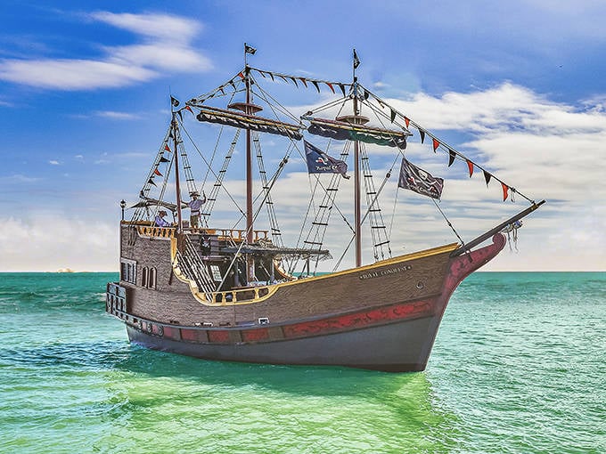 That's not a typo in your GPS, that's actually a pirate ship parked on the beach like it's the most normal thing in Florida.