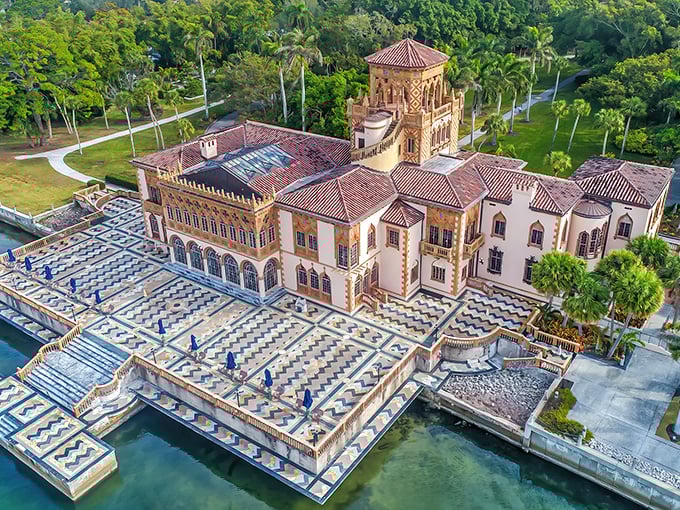 The John and Mable Ringling Museum of Art stands like a pink Venetian dream against Florida's impossibly blue sky, where culture meets circus magic.