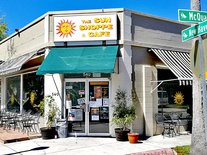The welcoming exterior of The Sun Shoppe & Cafe, where that cheerful sun logo promises good things await inside.
