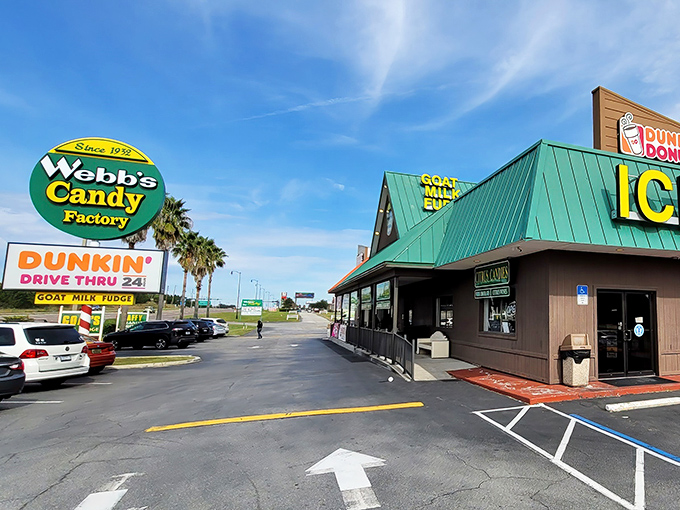 The iconic Webb's Candy Factory sign stands tall against Florida's blue sky, a beacon for sweet-toothed travelers since 1932.