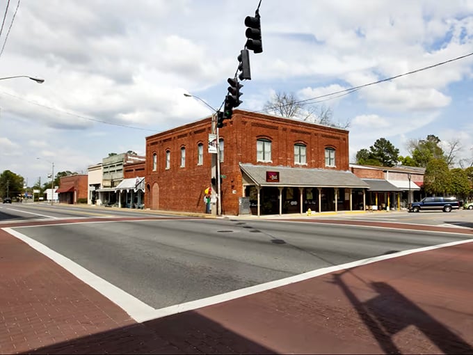 Historic brick buildings frame Havana's charming intersection, where time seems to slow beneath the watchful gaze of dangling sneakers.