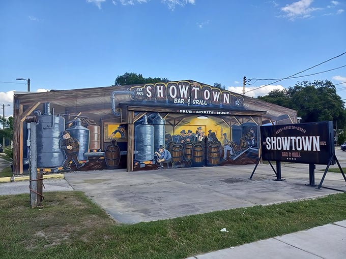 The colorful moonshine mural adorning Showtown's exterior isn't just decoration &ndash; it's your first hint that ordinary dining rules don't apply here.
