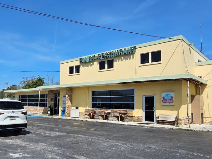 The unassuming yellow exterior of Betts Big T Restaurant stands like a time capsule from a bygone era, promising authentic comfort food within.