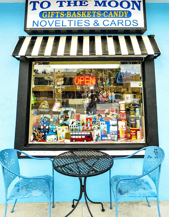 The iconic blue storefront of To The Moon Marketplace beckons candy lovers with its vintage charm and promise of sweet nostalgia.