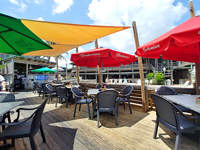 Waldo's sun-drenched deck invites you to kick back where colorful umbrellas dance in the ocean breeze.