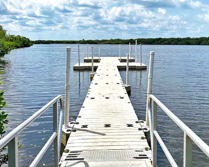 That dock stretching into Mobbly Bayou looks like it's inviting you to walk the plank, except instead of pirates, you'll find peace and possibly a manatee.