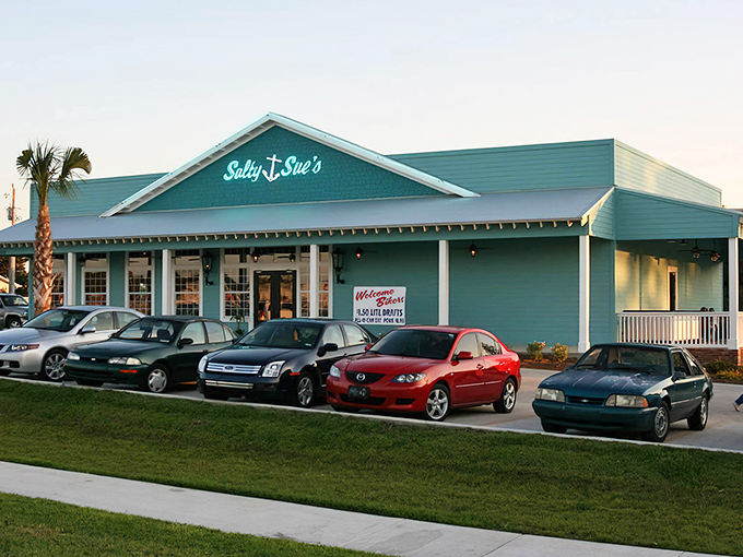 Salty Sue's turquoise exterior welcomes hungry visitors with coastal charm and the promise of smoky delights within.
