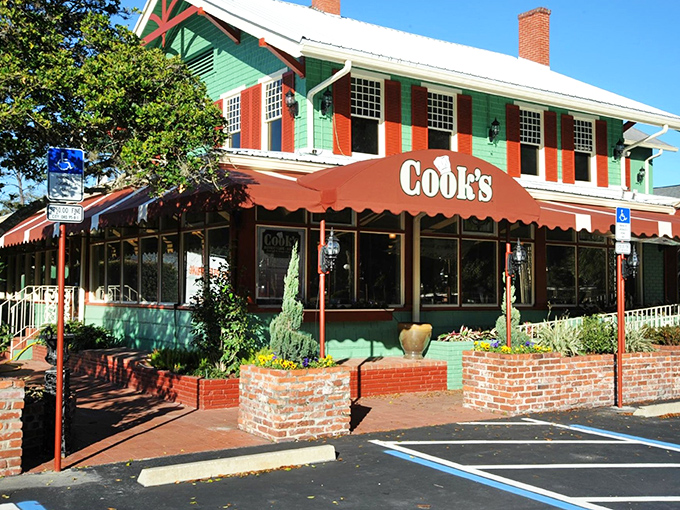 The charming red and green exterior of Cook's Buffet Cafe Bakery stands as a welcoming beacon of home-style cooking in DeLand, Florida.