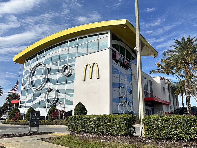 The iconic yellow arch roof of the World's Largest McDonald's dominates Orlando's International Drive skyline, promising more than just fast food inside.