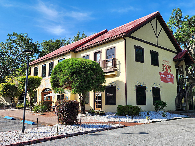 This charming yellow building looks like it took a wrong turn in Bavaria and ended up in Florida, complete with hand-painted murals that would make any German grandmother proud.