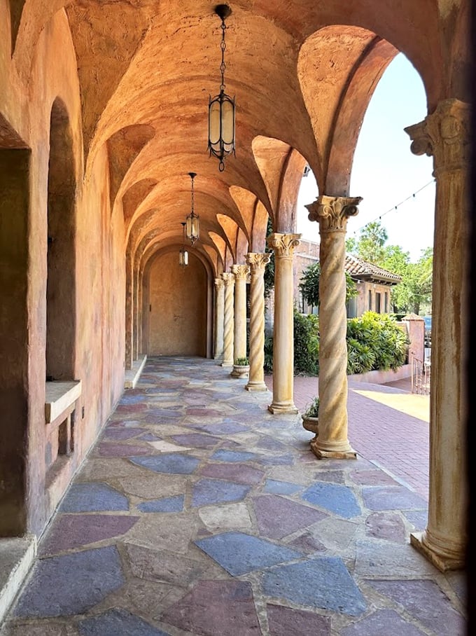 Twisted columns support arched ceilings along this exterior corridor, where light and shadow play throughout the day.