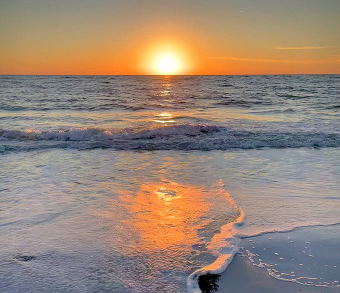 Beach Sunset View That magical moment when the sun dips into the Gulf, turning the sky into a painter's dream palette.