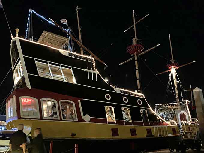 Even at night, the ship maintains its magical presence, lit up like a beacon calling to anyone with adventure in their heart.