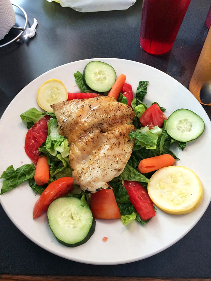 The bar area showcases decades of fishing history and local memorabilia &ndash; each photo frame holding stories as rich as the seafood bisque.