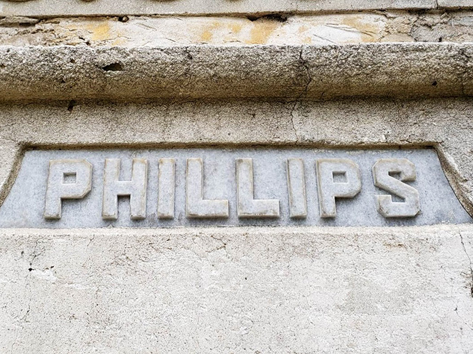 PHILLIPS &ndash; a family name carved in stone, now a landmark that outlived the man it memorializes and the hands that crafted it.