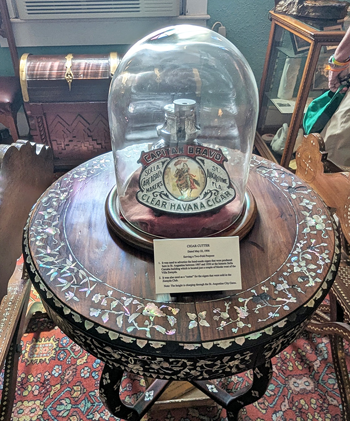 A vintage cigar cutter under glass &ndash; seemingly ordinary until you learn it survived the great St. Augustine fire of 1896.