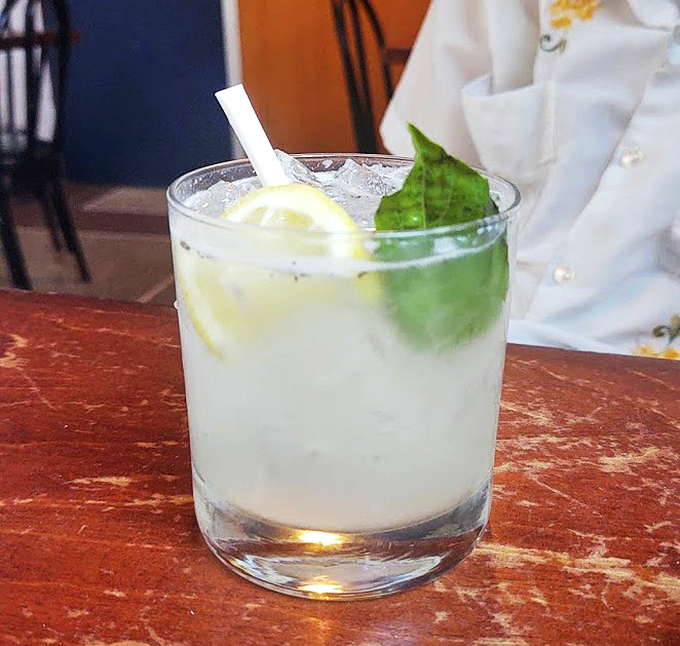 A refreshing lemon-mint concoction that cuts through rich pizza flavors like a cool breeze on a humid Florida afternoon.