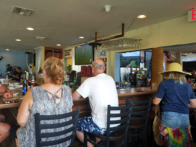 A laid-back crowd enjoys cold drinks and easy conversation inside this friendly, casual waterfront bar.