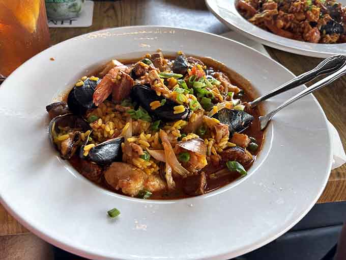 Seafood paella loaded with shrimp, mussels, and saffron-infused rice delivers a taste of the Mediterranean with Caribbean flair.